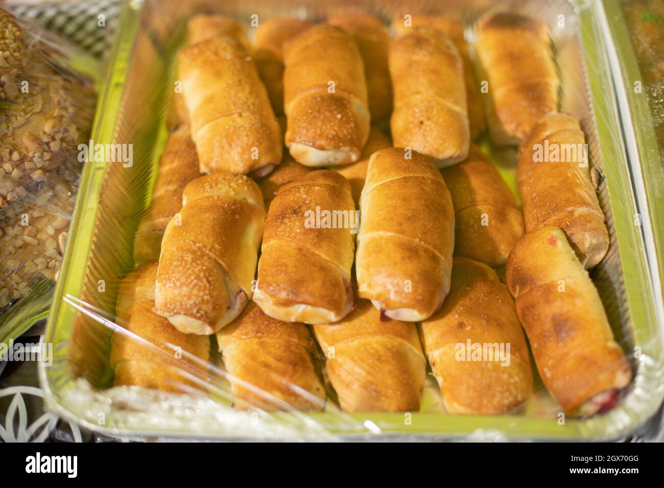 Sweets packed in film. Sale of delicious food. Boxes of sugar treats ...