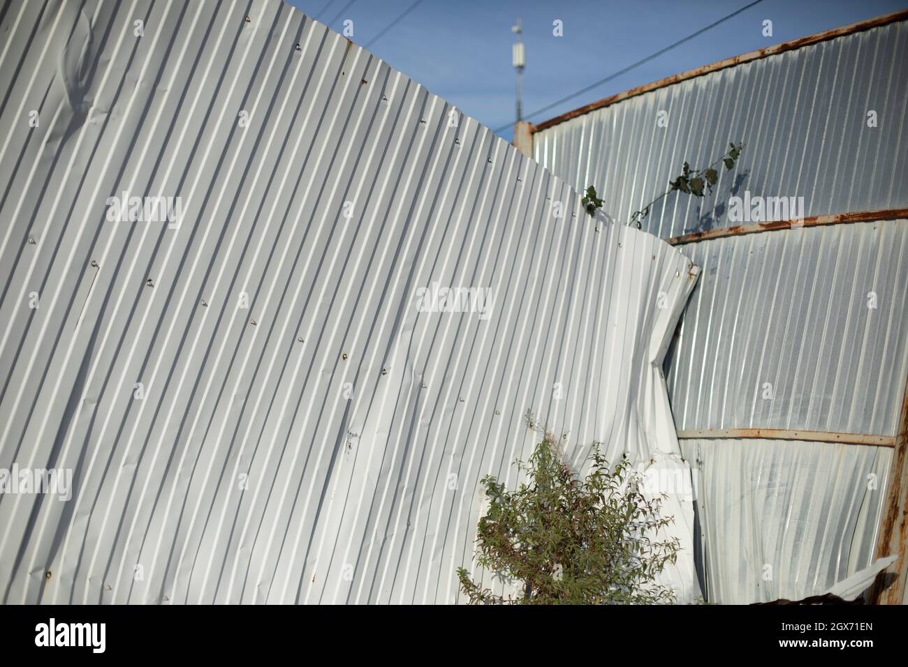 Broken stainless steel fence. Damaged fencing. Crudded metal Stock ...