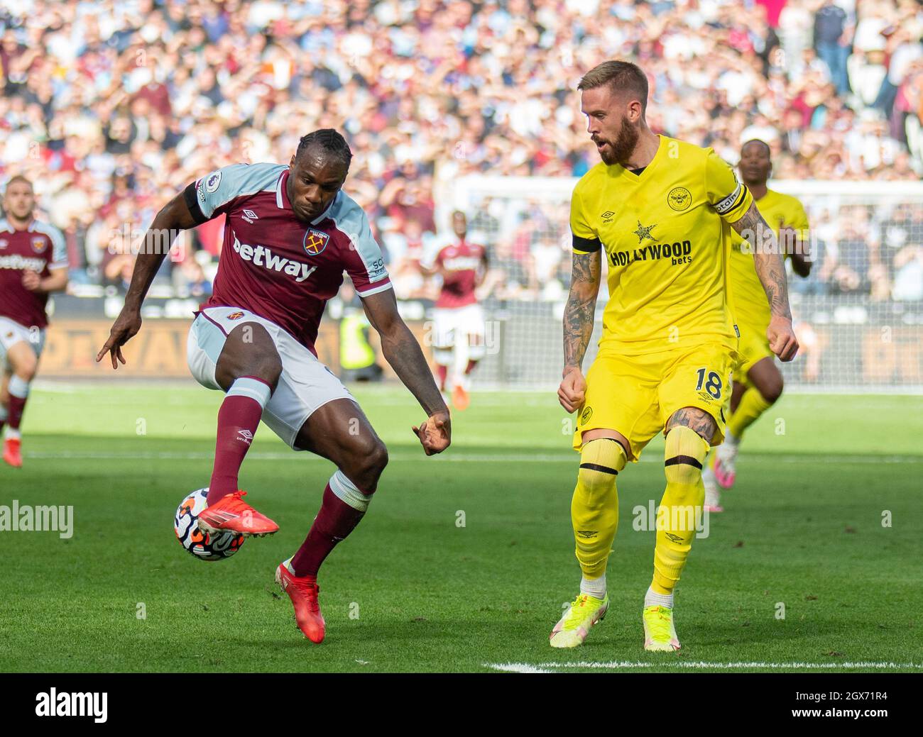 London, UK. 03rd Oct, 2021. West Ham United Michail Antonio and Brentford Pontus Jansson during ...