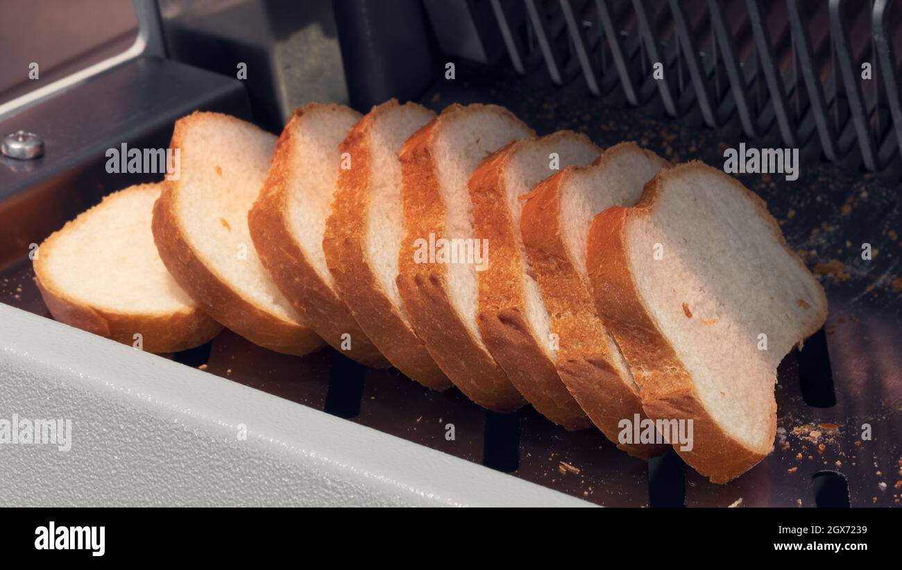 Sliced white bread in a cutting machine Stock Photo - Alamy
