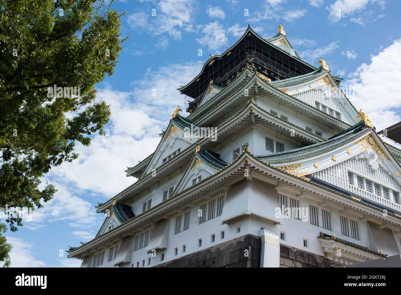 Close up of the facade of the Osaka castle. Blue sky with clouds. Osaka ...