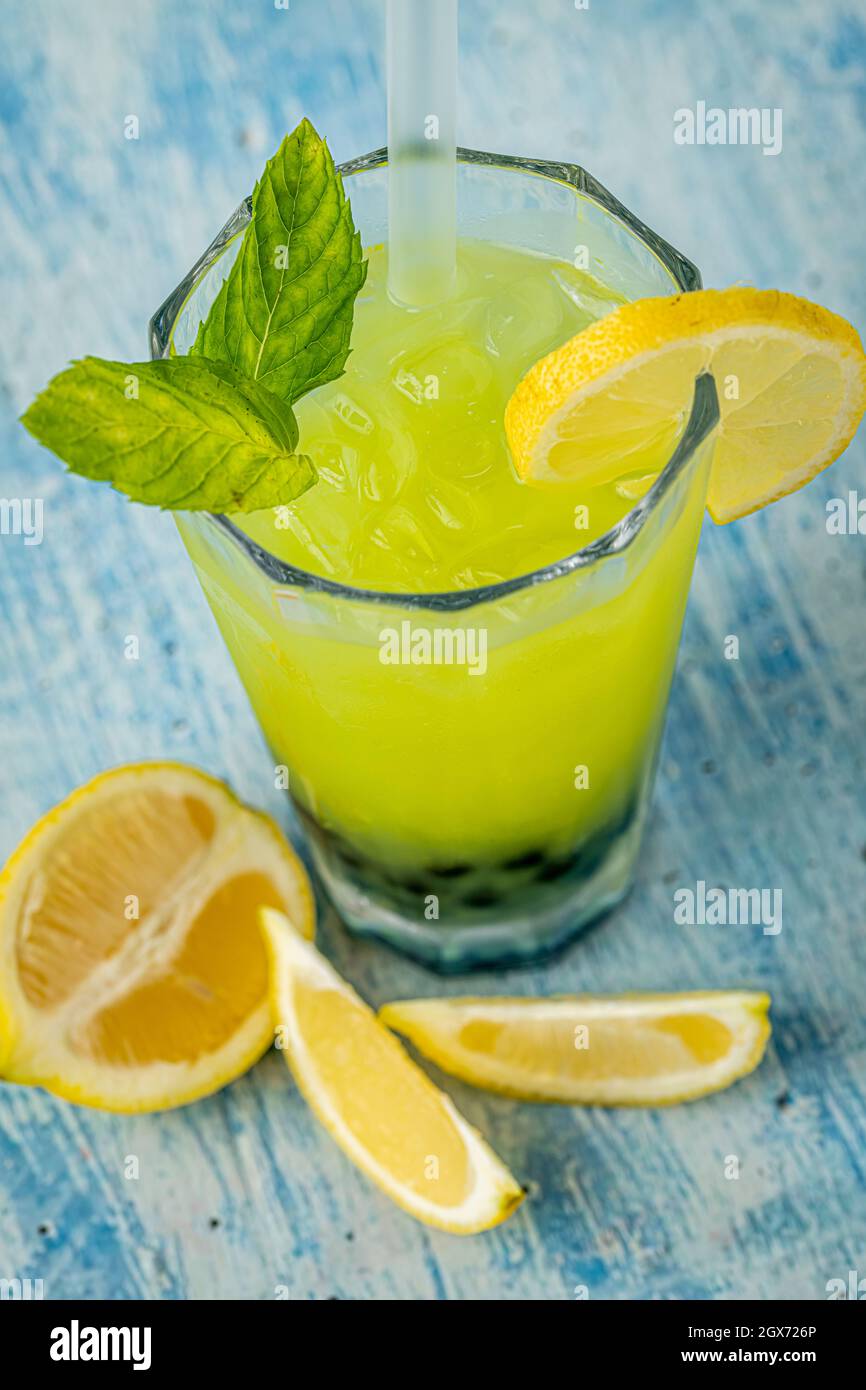 Lemonade with bubble tea on blue stone background Stock Photo - Alamy