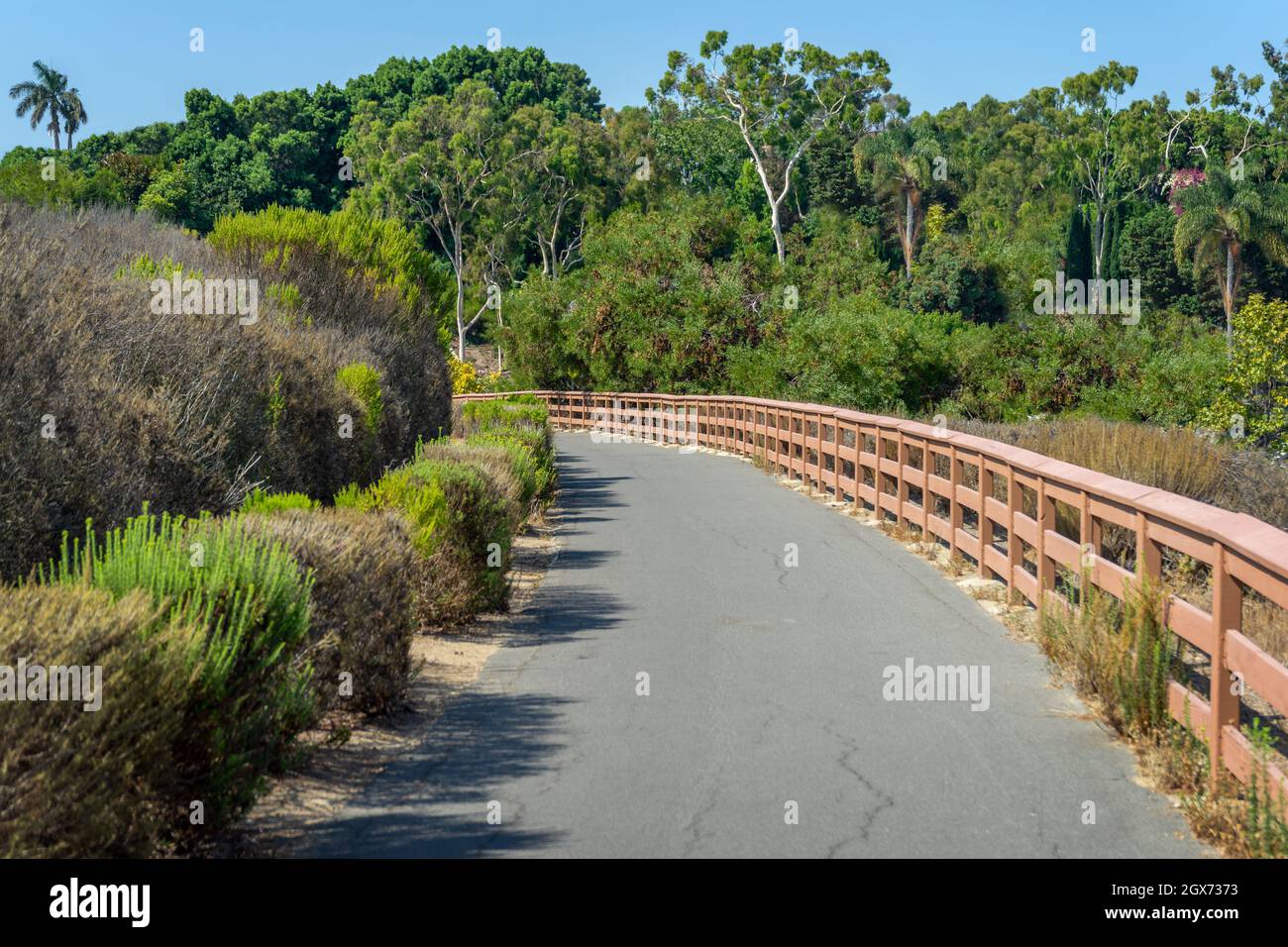 Downhill walking path with railing at Castaways Park in Newport Beach ...