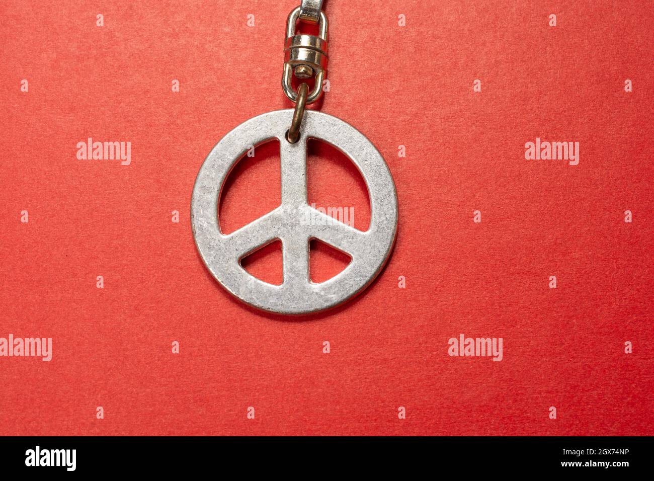 Closeup shot of the symbol of peace on a red background Stock Photo - Alamy