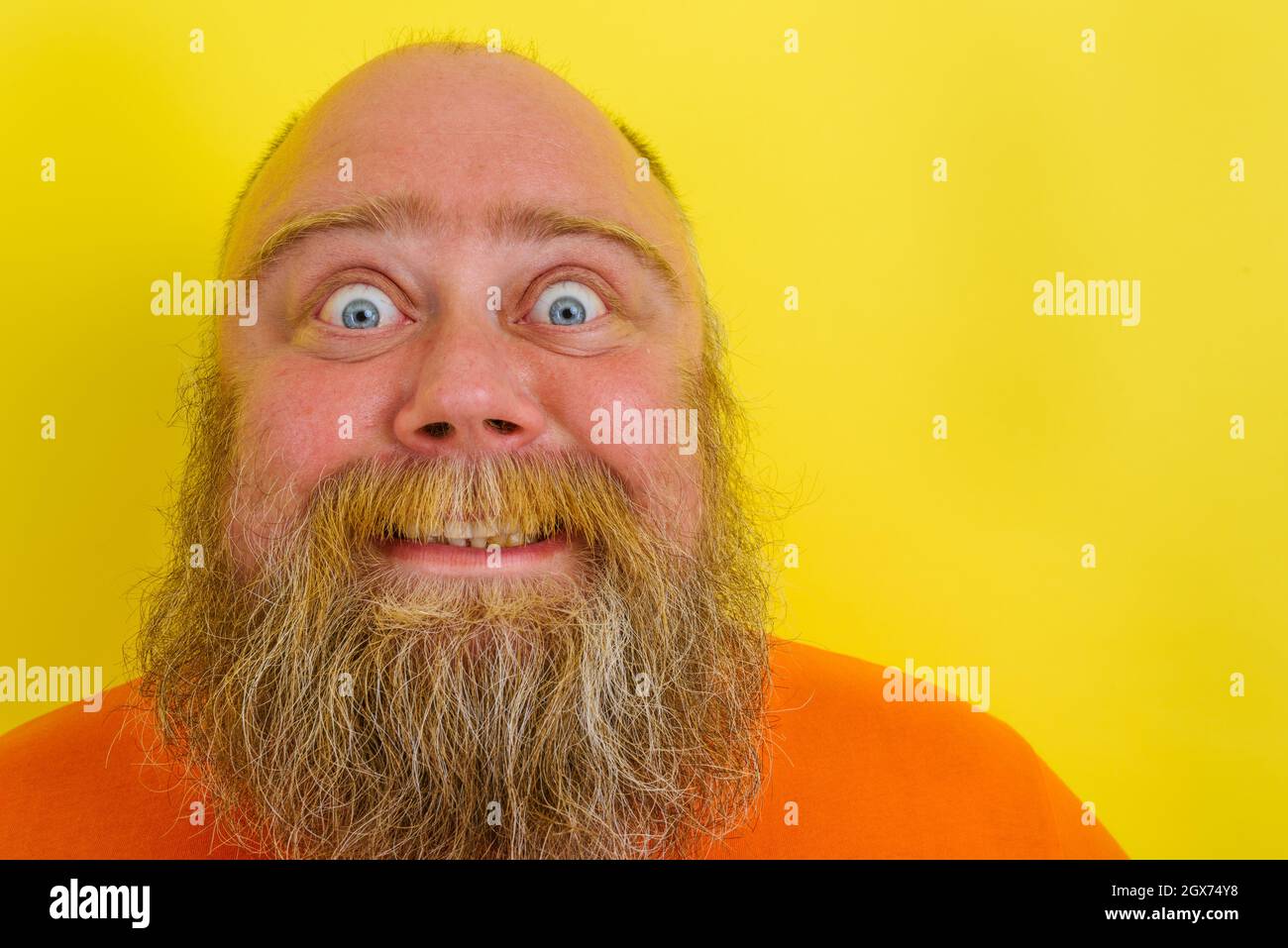 Afraid man with beard and tattoos is worried about something Stock ...