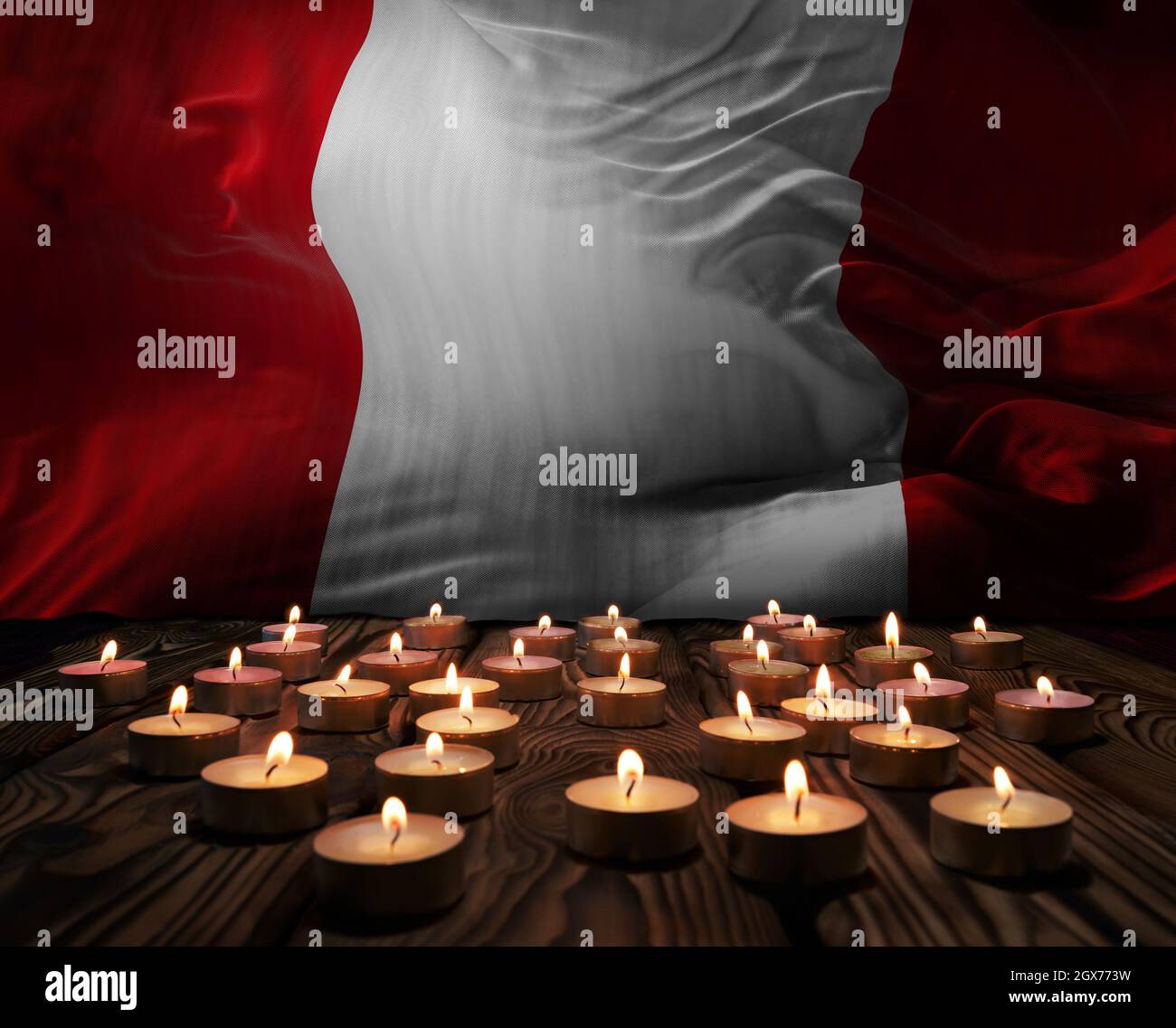 Mourning candles burning on Peru national flag of background. Memorial ...