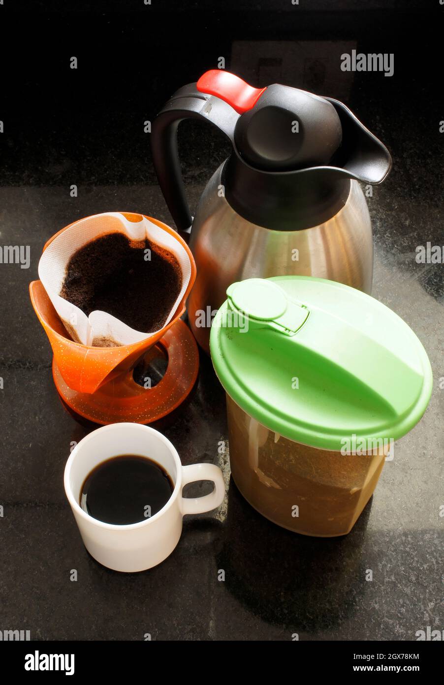 Typical strained Brazilian coffee. Stainless steel jar, container for ...
