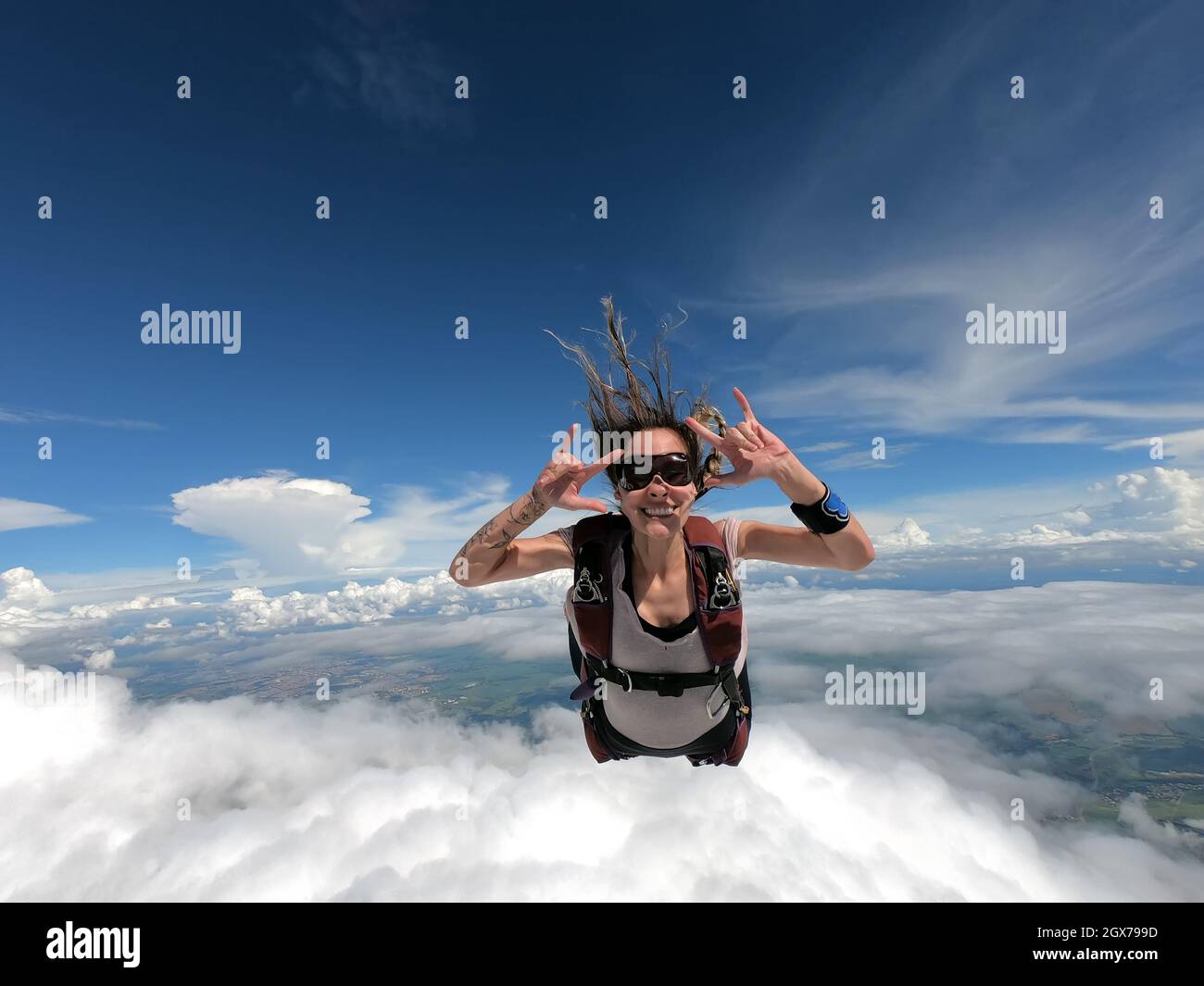 A young woman in a position of tracking at high speed. Parachuting ...