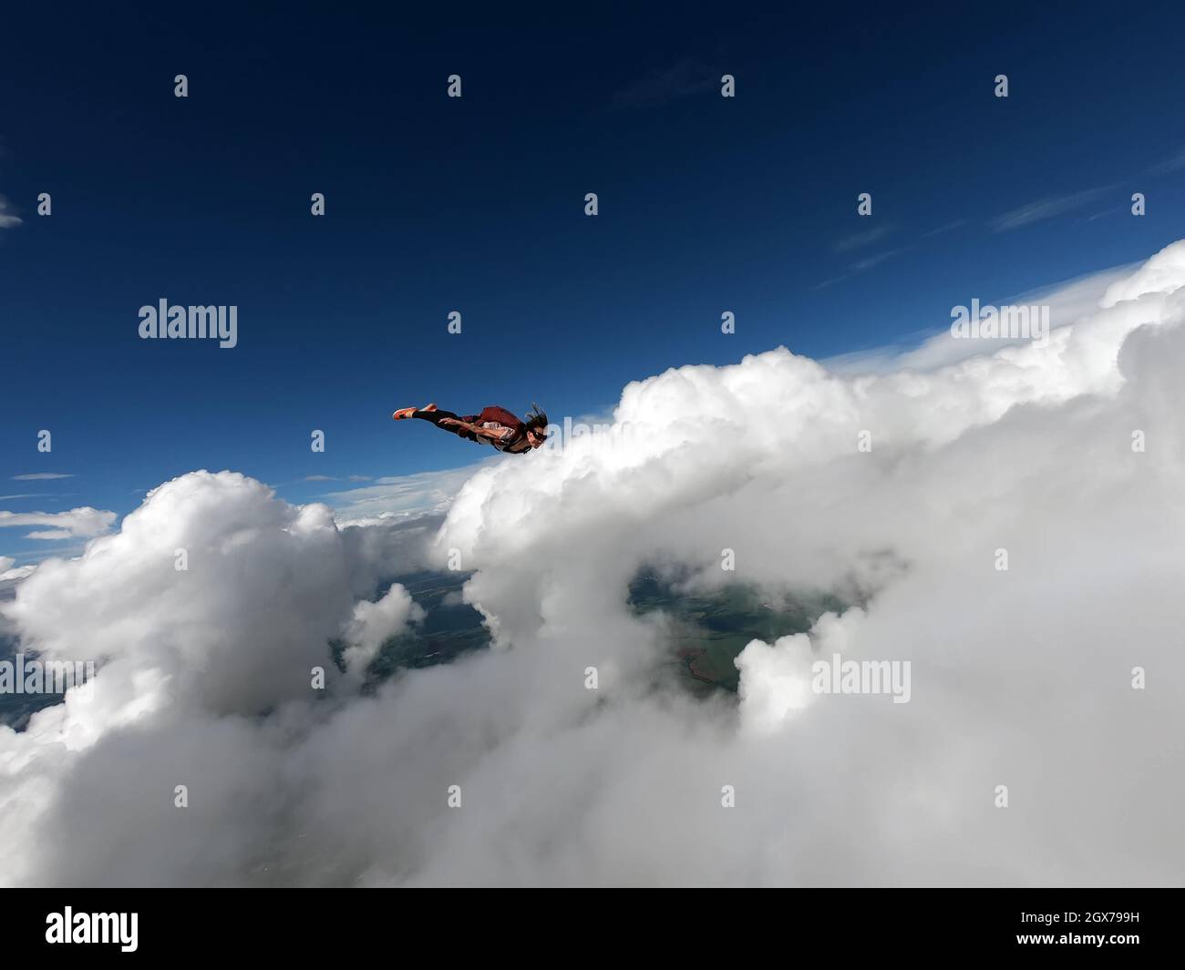 A young woman in a position of tracking at high speed. Parachuting ...