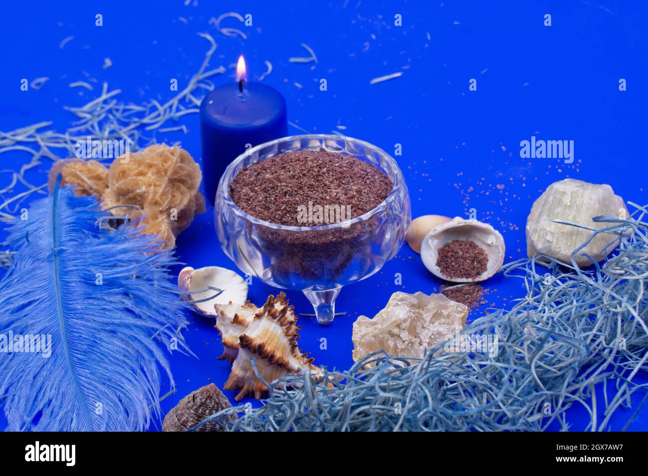 Spa products with sea shells and salt on blue background. Beauty ...