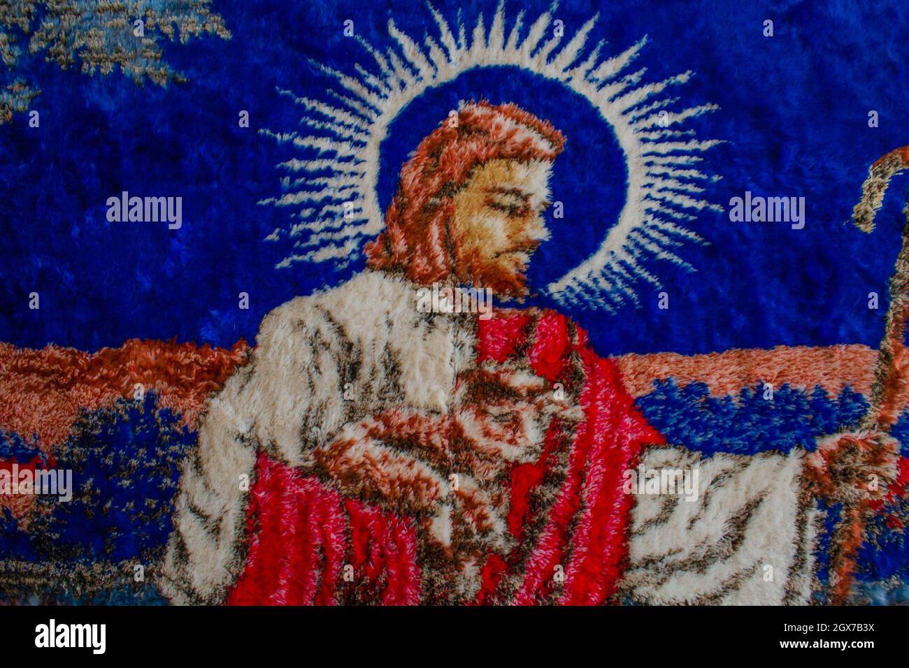 Jesus on a wall carpet. Religious relic Stock Photo - Alamy