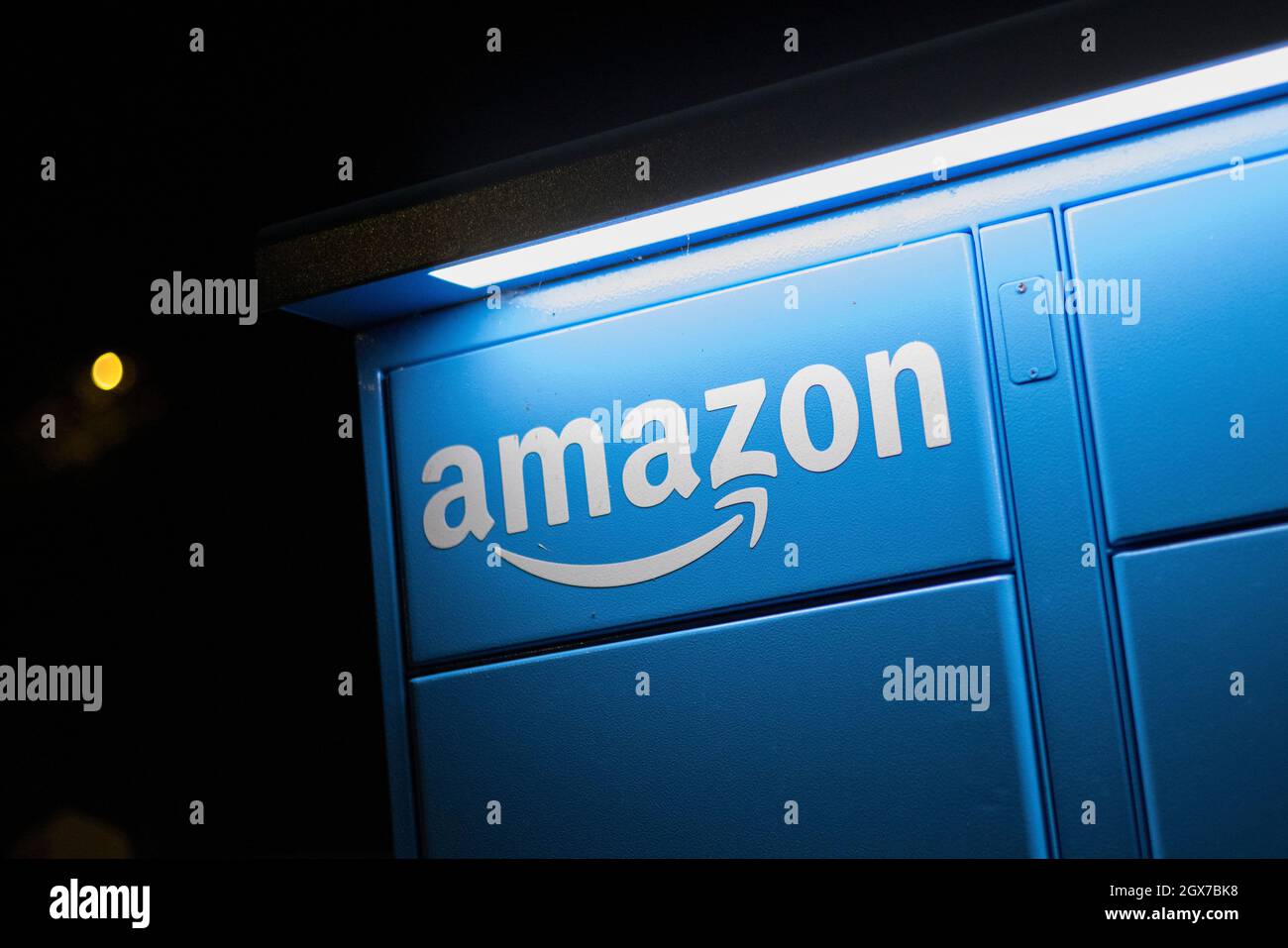 Amazon Hub Locker seen at night in the car park of Kenley Train Station ...