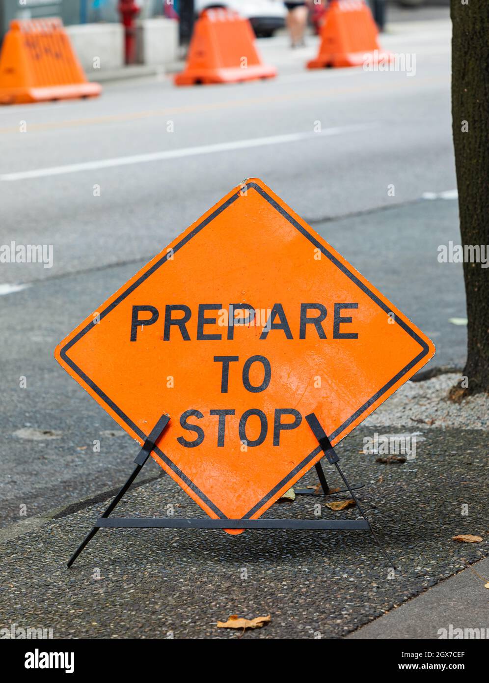 Road construction sign Prepare to Stop in a street of a city, selective ...