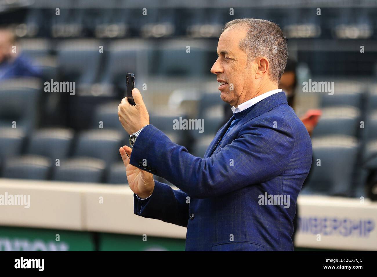 Comedian Jerry Seinfeld does a promo on the field before the baseball ...