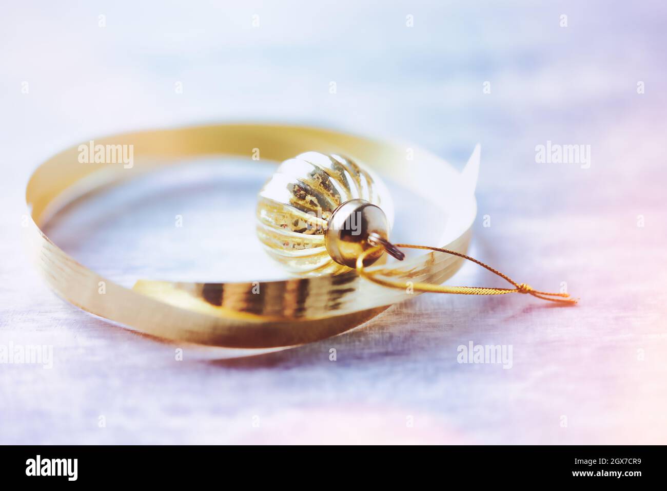 Christmas golden bauble on wooden background. Close up Stock Photo - Alamy