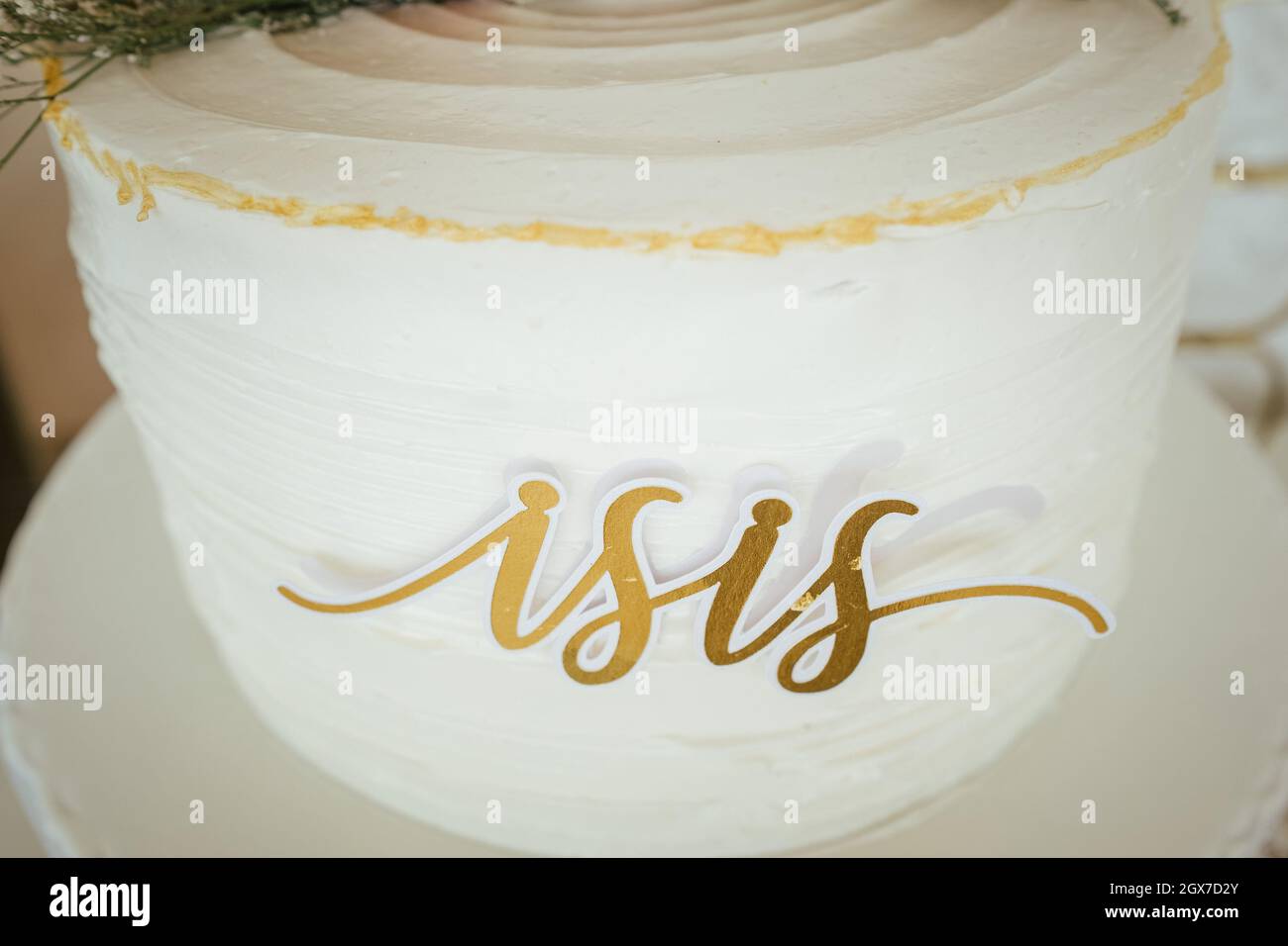 RANDOM, PORTUGAL - Jun 01, 2021: A beautiful white cake with isis text ...