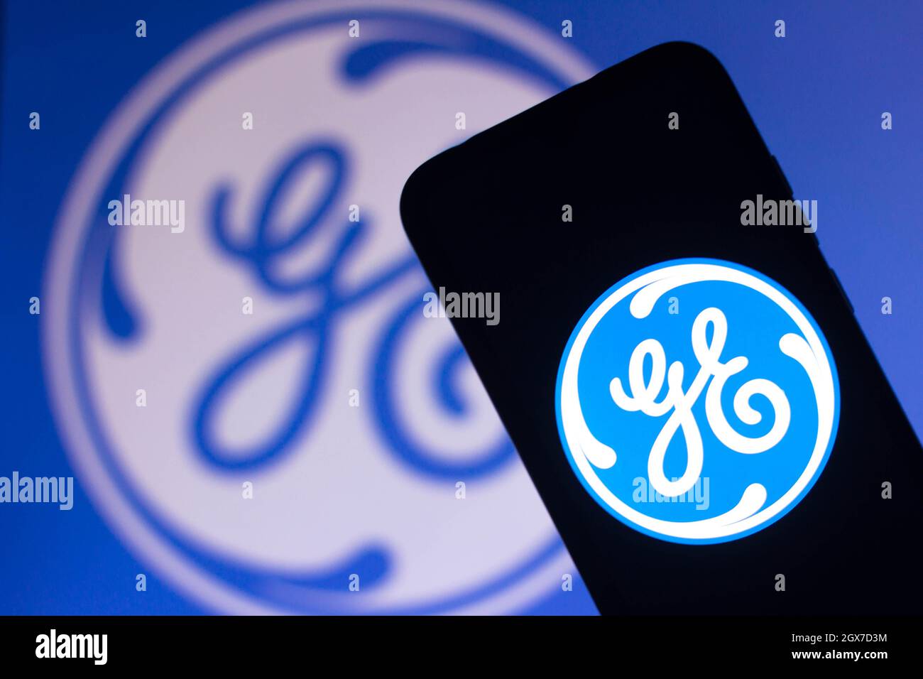 In this photo illustration the General Electric (GE) logo seen ...