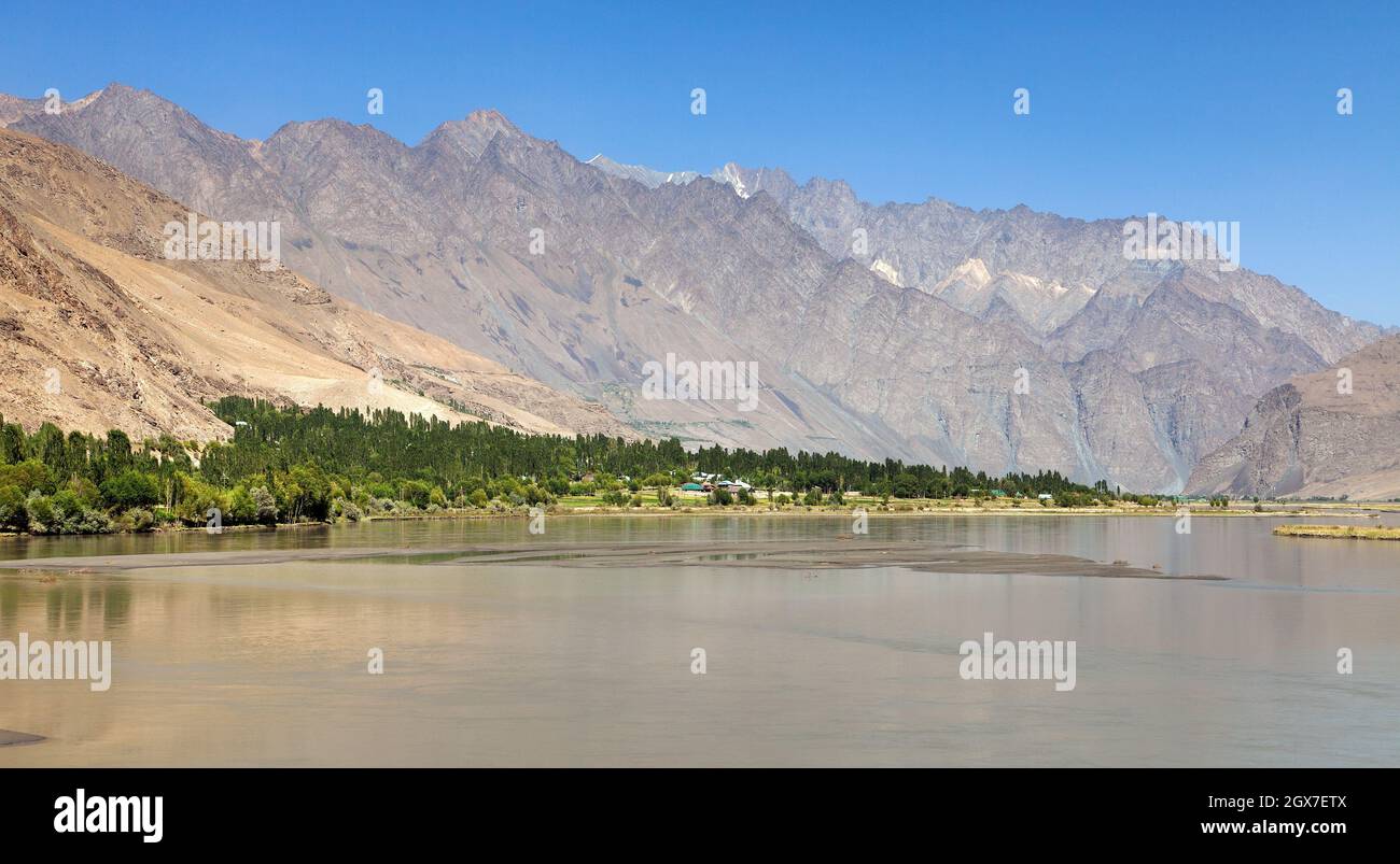 Panj river and Pamir mountains panoramic view. Panj is upper part of ...