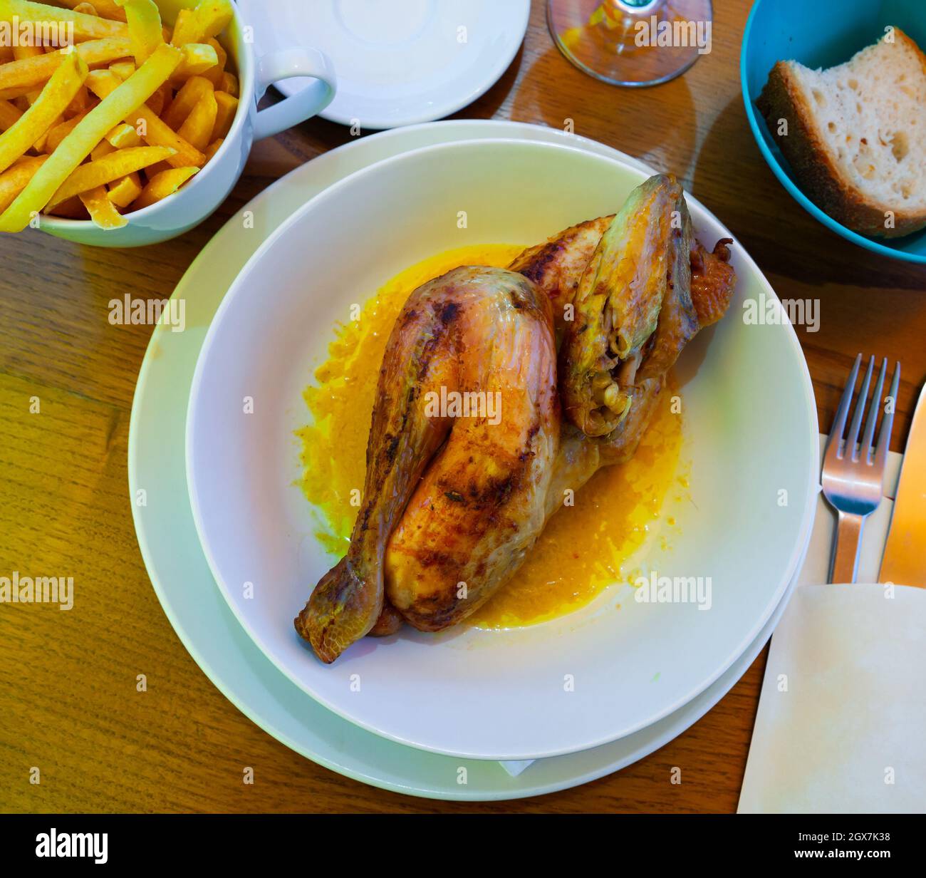 Baked chicken half with sauce. Swiss cuisine Stock Photo - Alamy
