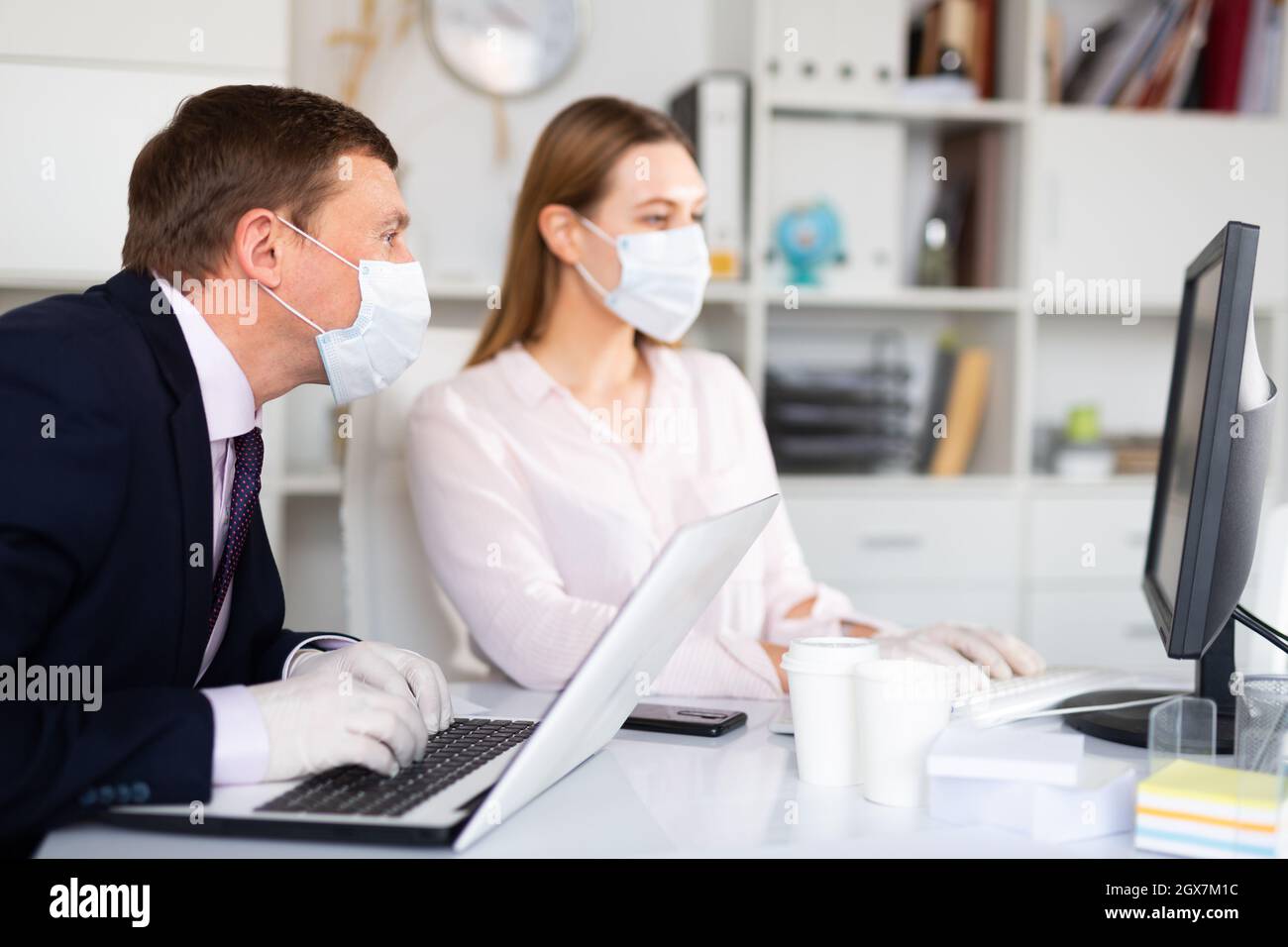 Use of personal protective equipment by office workers Stock Photo - Alamy