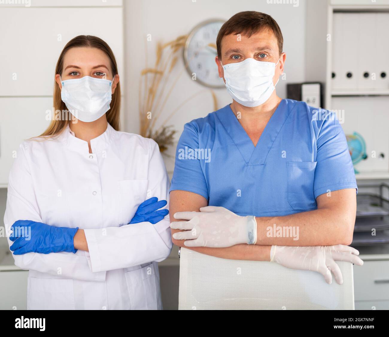 Two professional health workers in medical office Stock Photo - Alamy