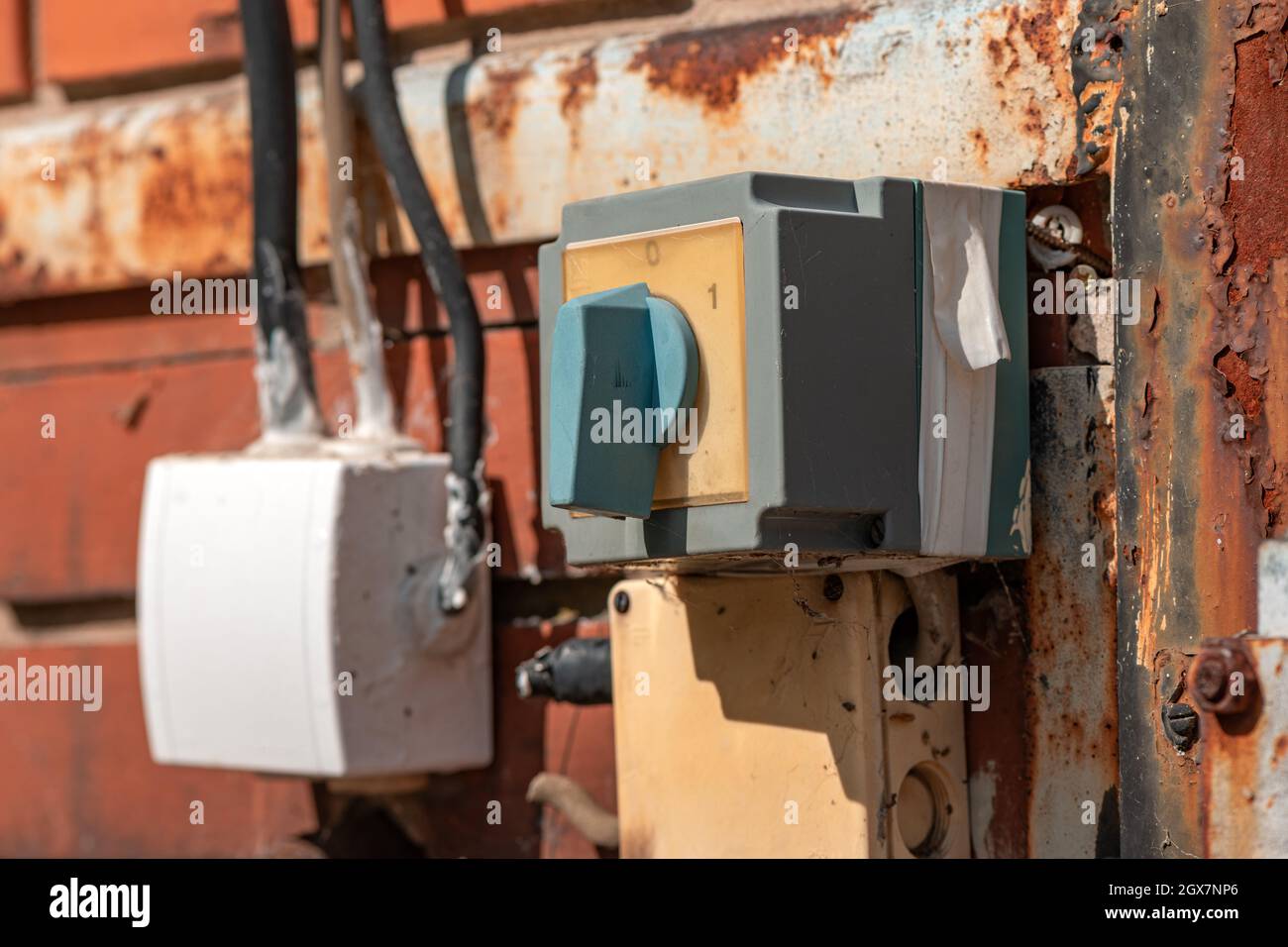 Old electricity switch on house exterior wall Stock Photo - Alamy
