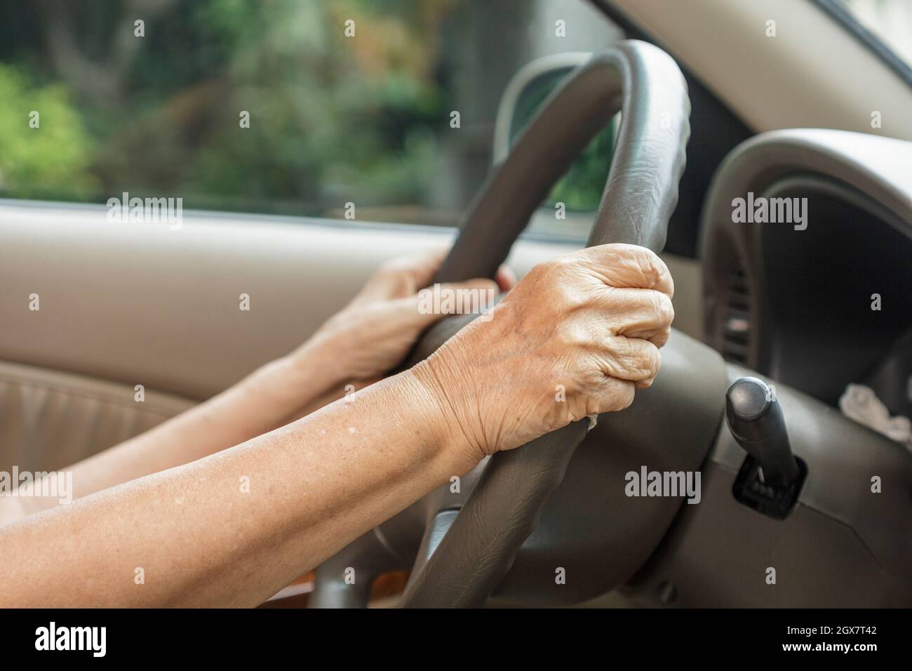 Senior woman driving a car Stock Photo - Alamy