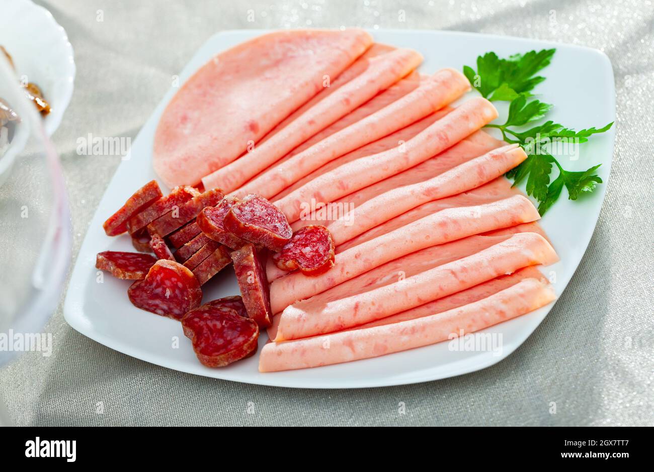 Delicious mortadella and chorizo sausages on plate Stock Photo - Alamy