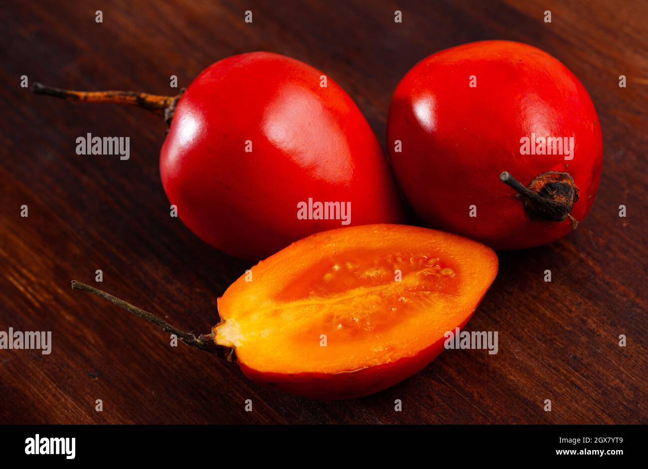 Whole and sliced tamarillos Stock Photo - Alamy