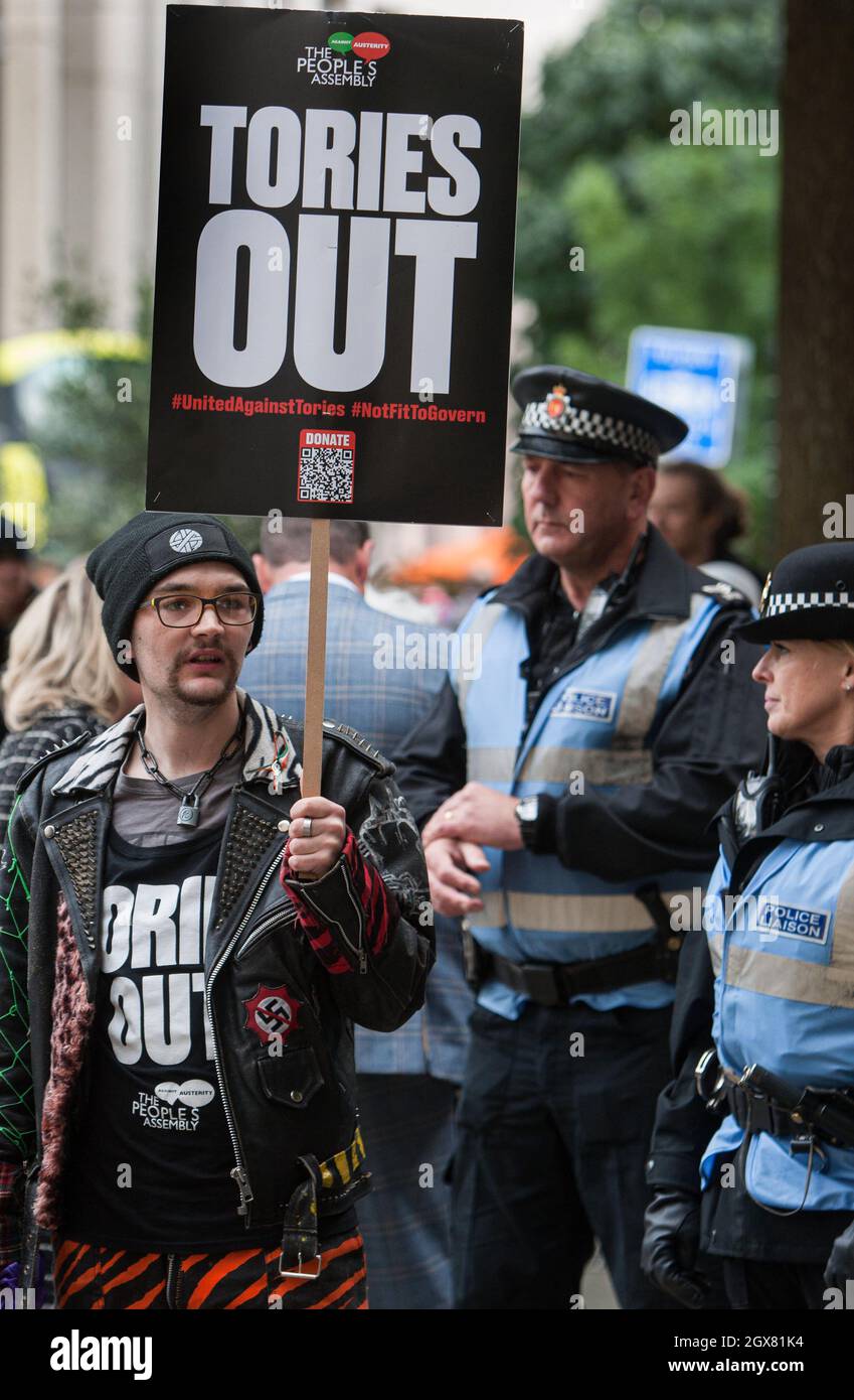 Manchester, UK. 04th Oct, 2021. A protester holds a placard during the ...