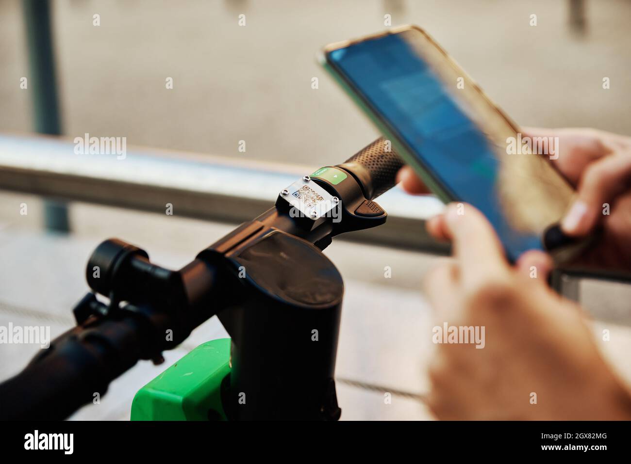 Woman unlock electric scooter for rent using mobile phone app. Modern ...