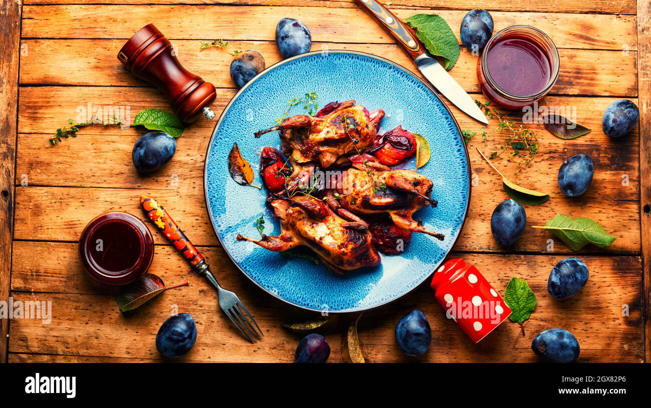 Fried quail in plum sauce.Meat with plum.Baked quail,top view Stock ...
