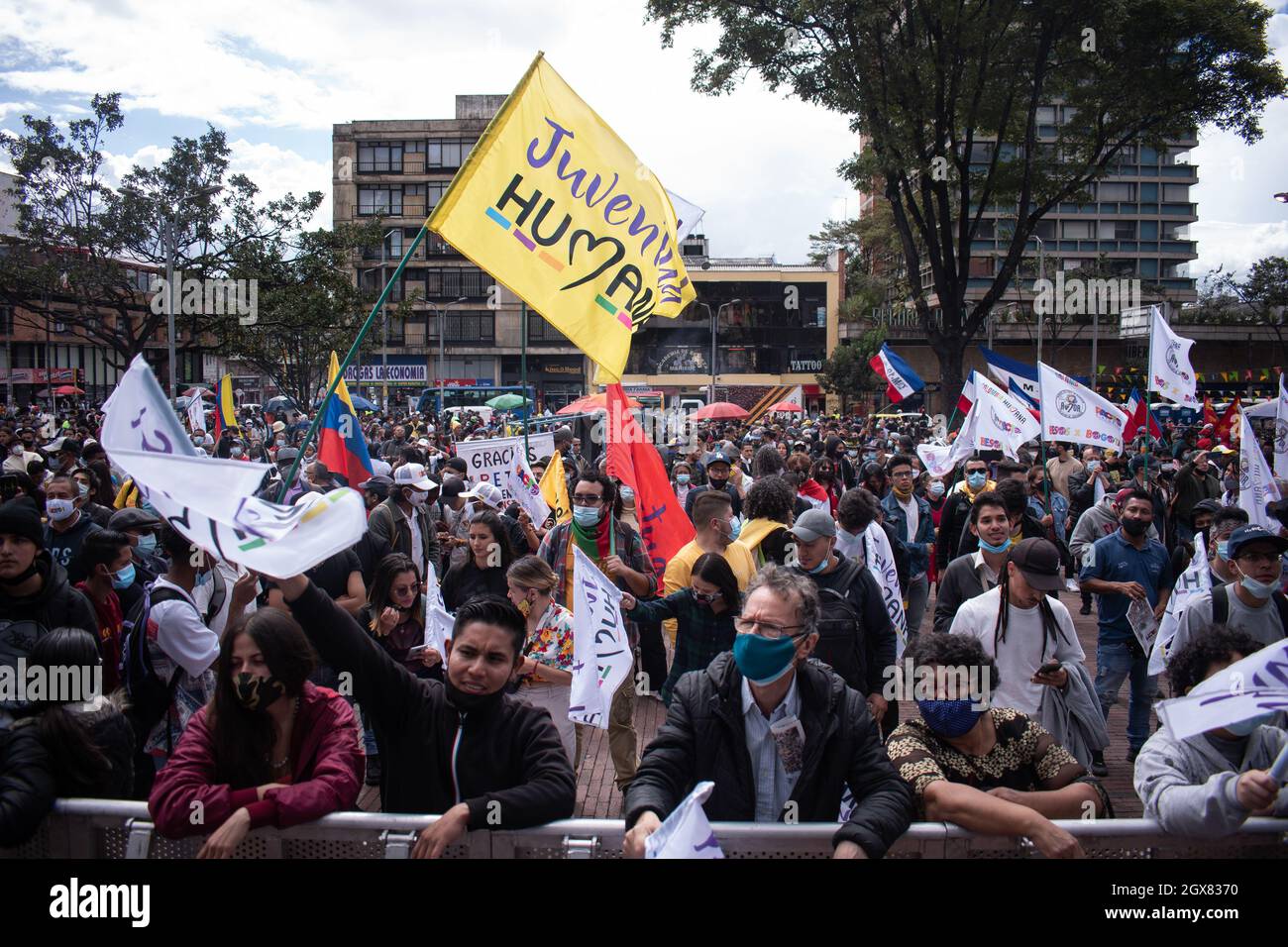People wave flags of political parties at the presentation of the ...
