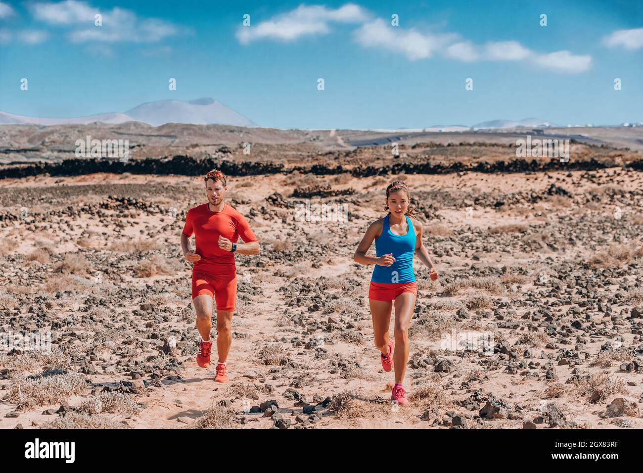 Sport athletes runners trail running training endurance in desert ...