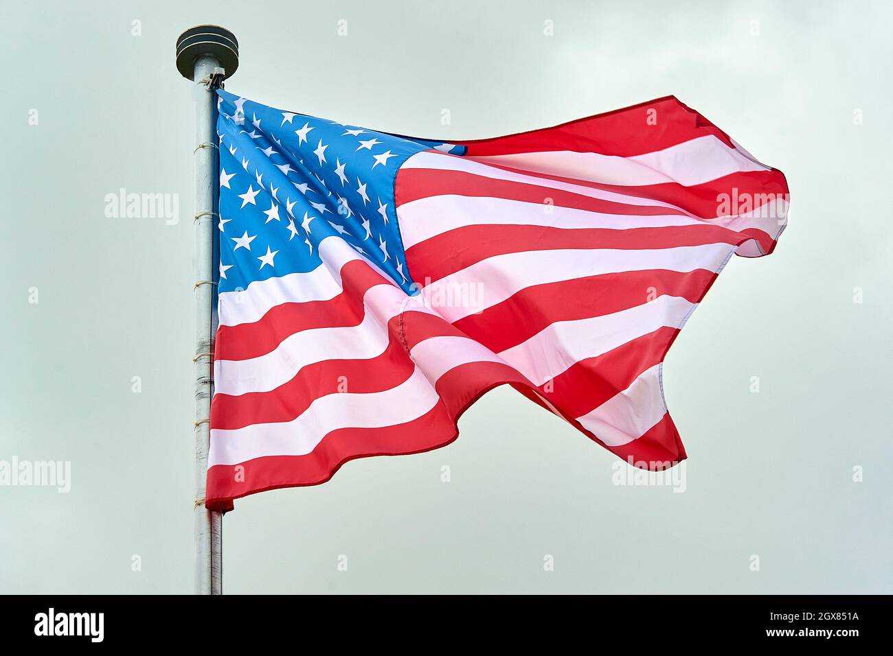 The USA flag is hanging on the flagpole Stock Photo - Alamy