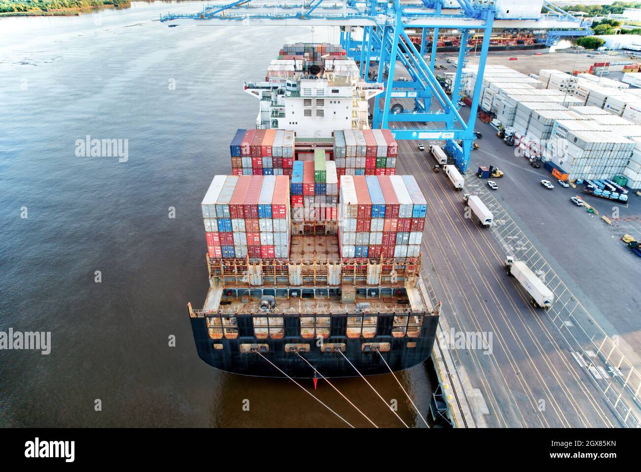 Cargo Ship Loaded with Cargo Sitting in Port Stock Photo - Alamy