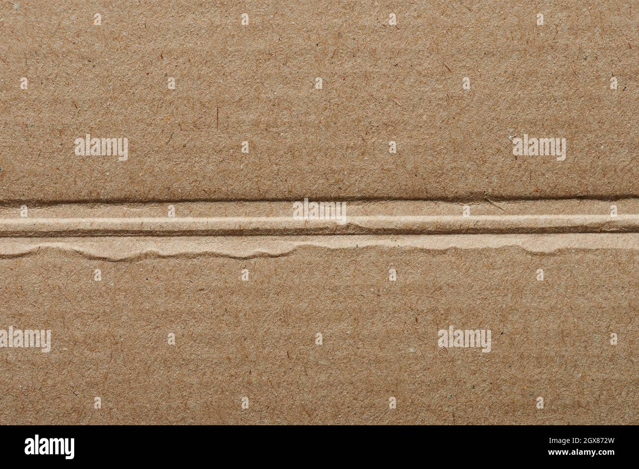Bend line on brown paper background macro close up view Stock Photo - Alamy