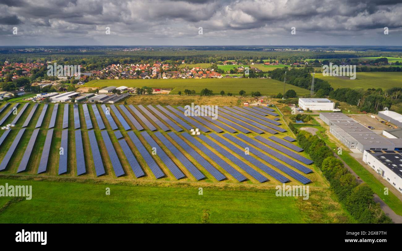 Aerial view of a large solar plant with solar panels on the edge of a ...