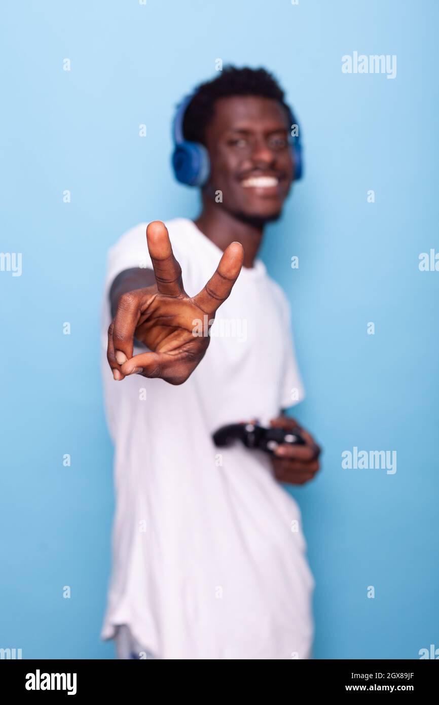 Man holding peace sign hi-res stock photography and images - Alamy