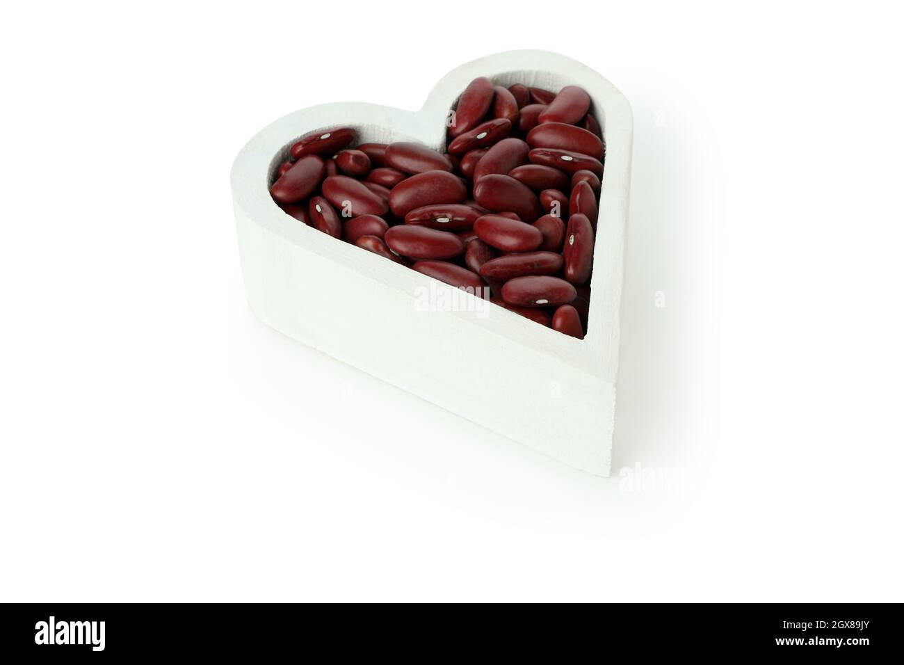 Red beans in the form of heart isolated on white background Stock Photo ...