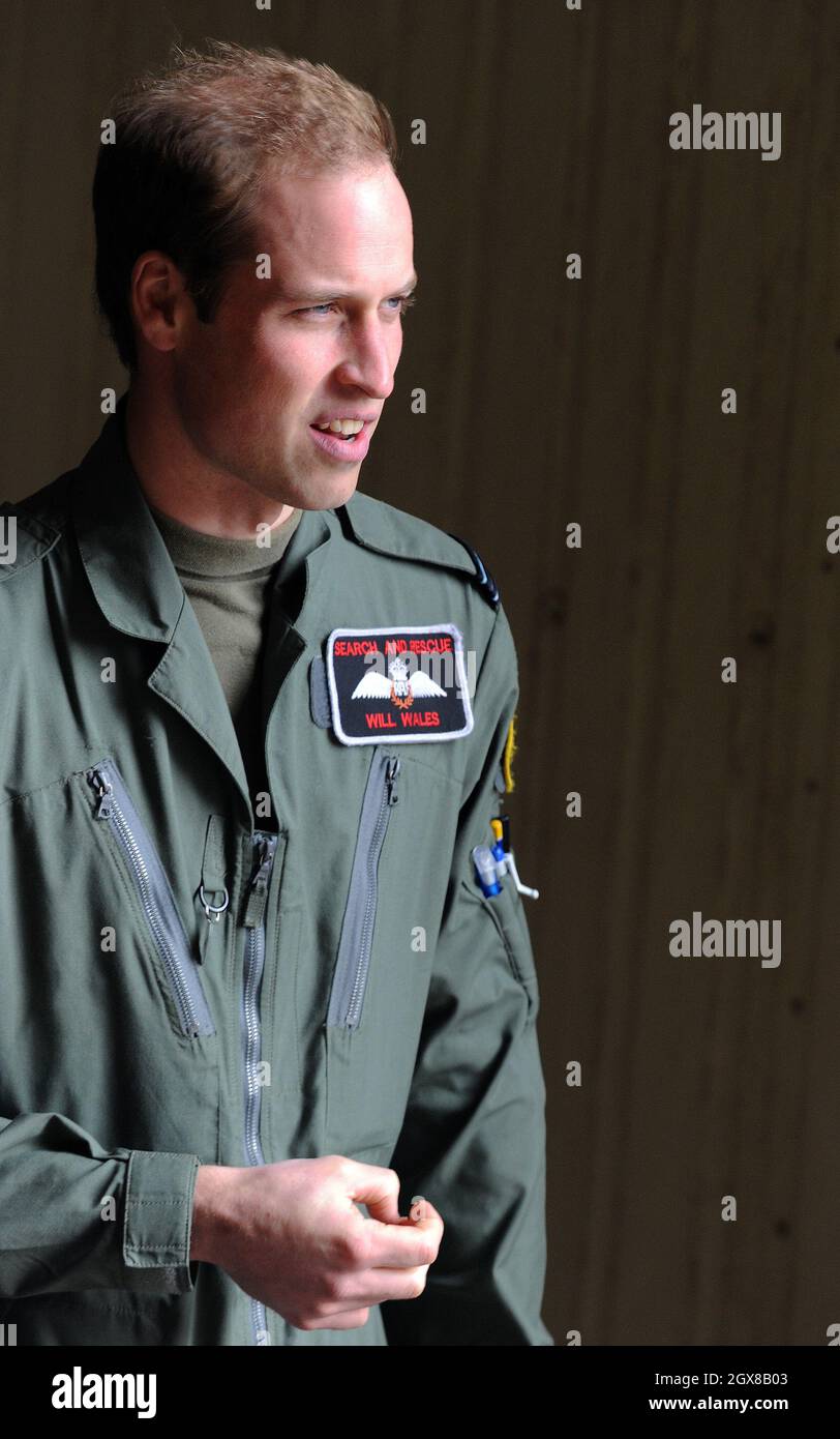 Prince William waits to meet Queen Elizabeth ll as she visits RAF ...