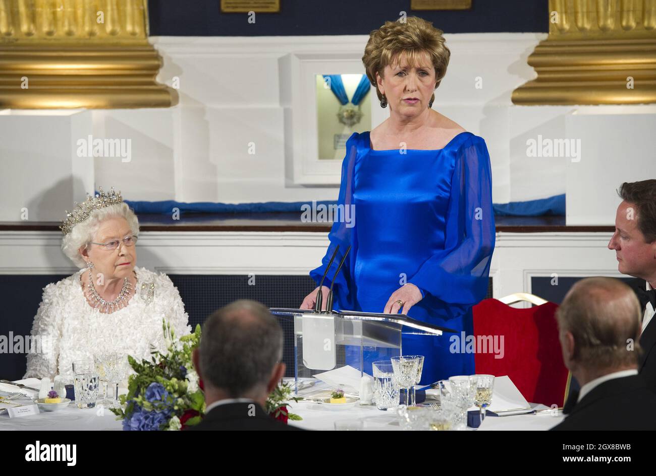 Queen Elizabeth II listens as Irish President Mary McAleese delivers a ...