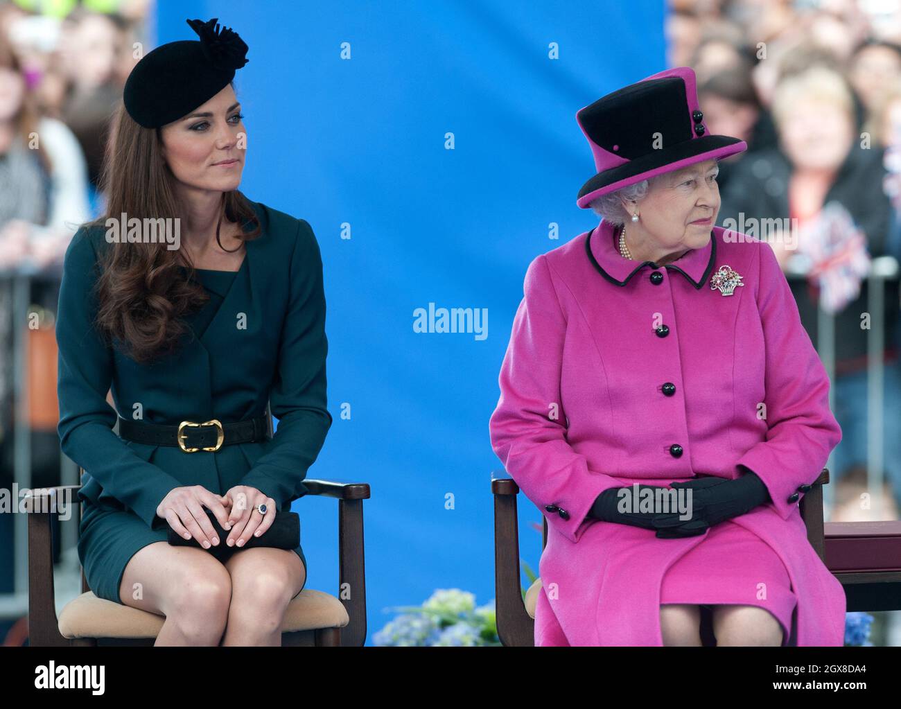 The Duchess of Cambridge and Queen Elizabeth II listen to a welcome ...
