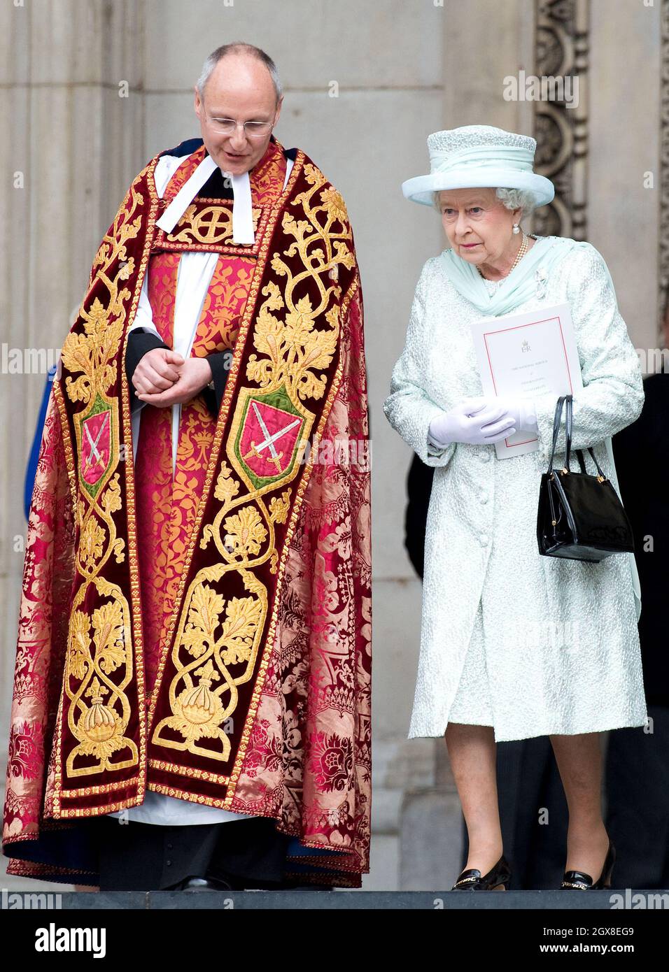 Queen Elizabeth ll, accompanied by the Dean of St. Paul's David Ison ...