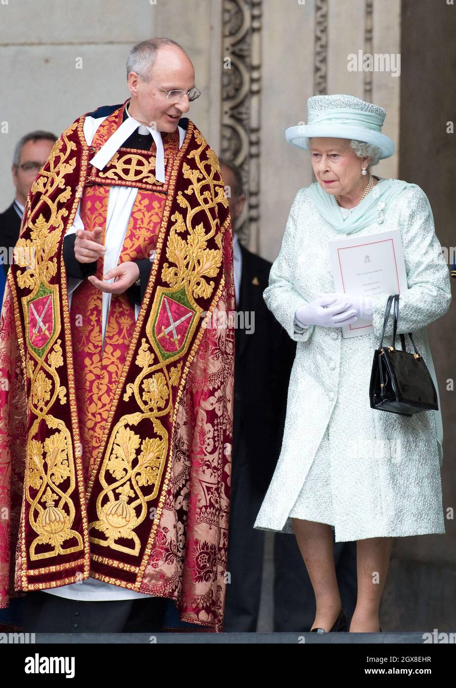 Queen Elizabeth ll, accompanied by the Dean of St. Paul's David Ison ...