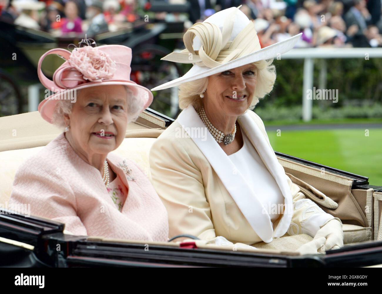 Queen Elizabeth ll and Camilla, Duchess of Cornwall arrive in an open ...