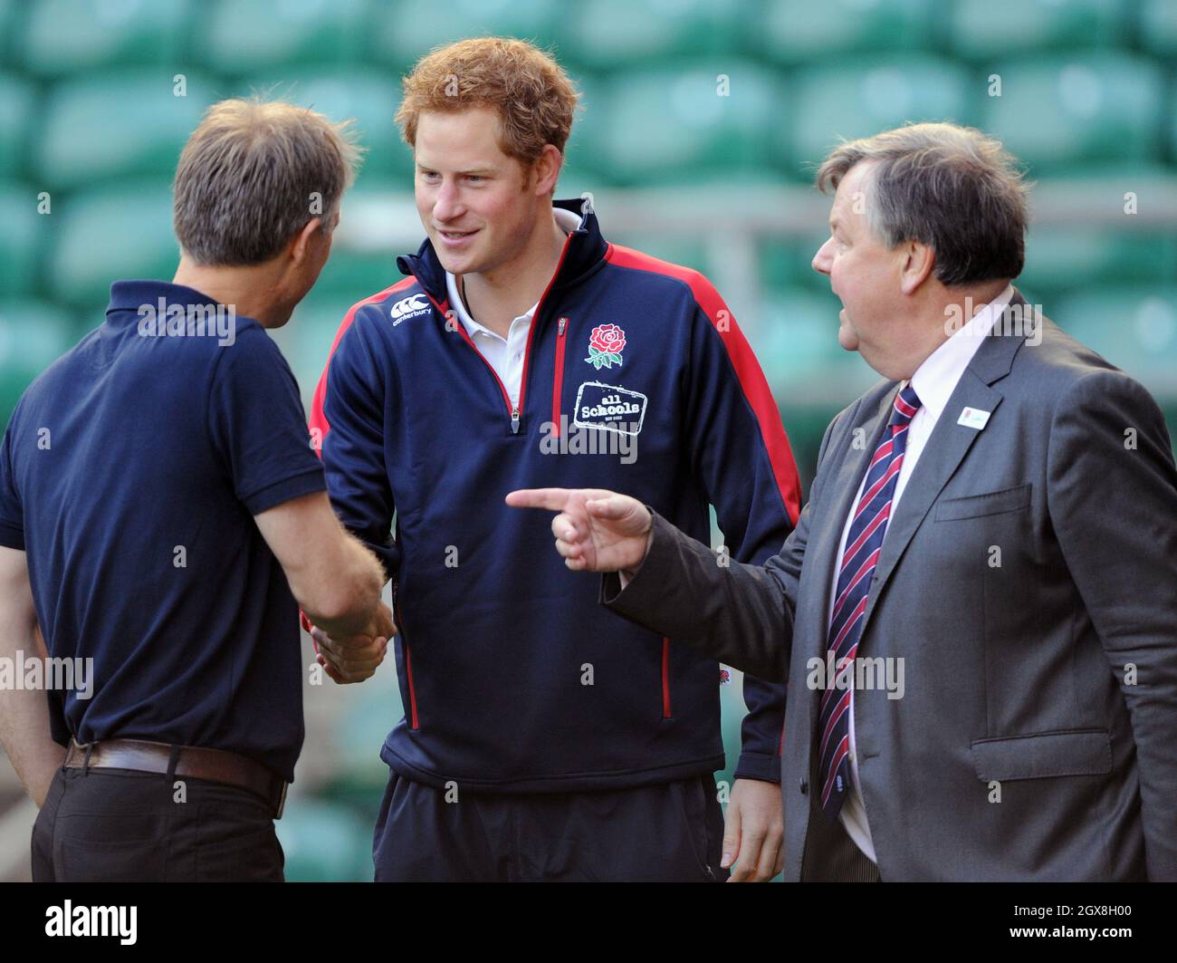 Prince Harry chats to Mark Saltmarsh (L) and Ian Ritchie at the Rugby ...