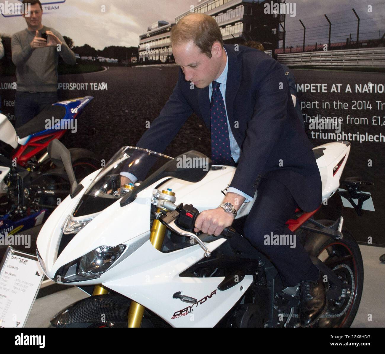 Prince William, Duke of Cambridge sits on a motorbike during a visit to ...