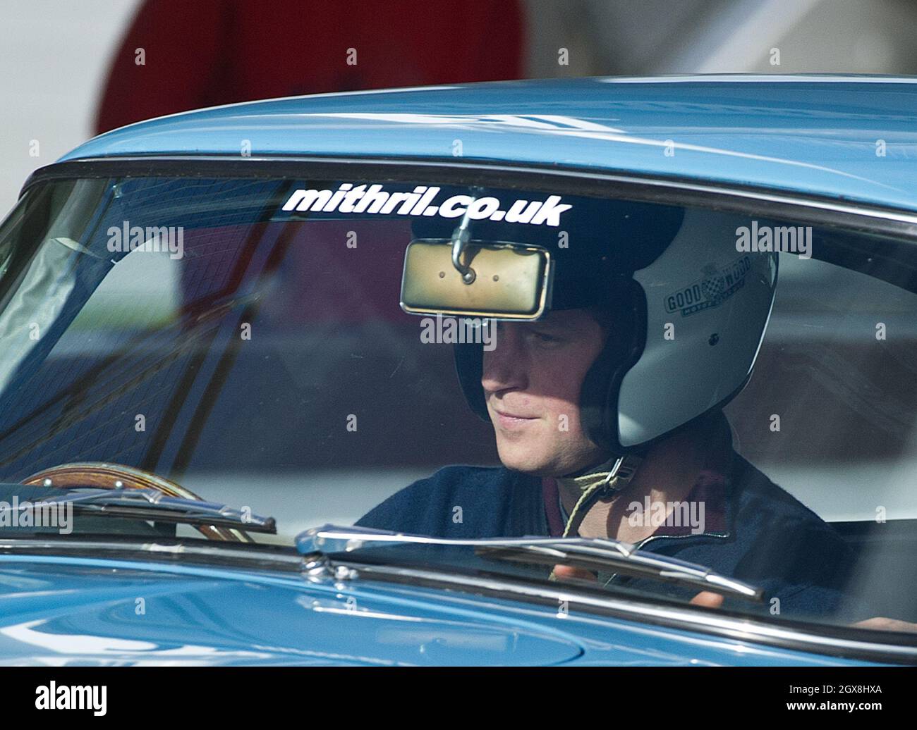 Prince Harry drives a vintage Aston Martin car as he attends The Royal ...