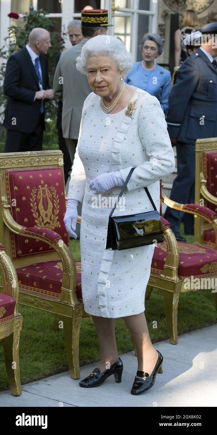 Queen Elizabeth II attends a garden party at the British Embassy in ...